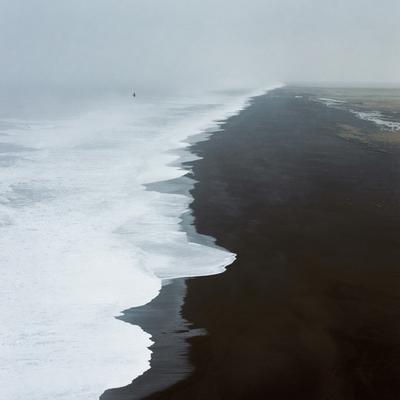 foamy-ocean-waves-washing-up-on-volcanic-beach - KDE Store