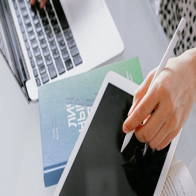 Person Using Macbook And Ipad - KDE Store