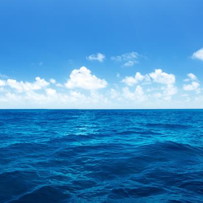 Blue Ocean Under Blue Sky and White Clouds During Daytime - KDE Store