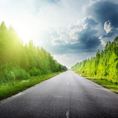 Gray Concrete Road Between Green Grass Field - KDE Store