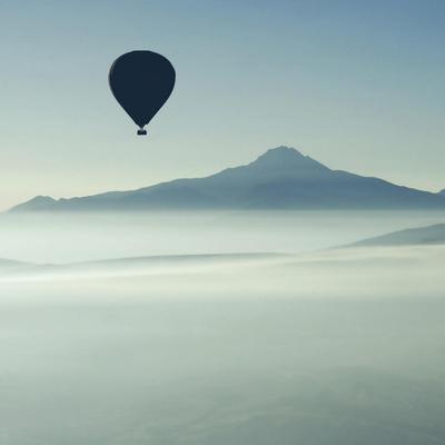 Blue Hot Air Balloon Flying Over The Mountains - KDE Store