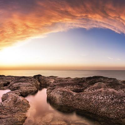 Beach reef arched clouds sunset horizon - KDE Store